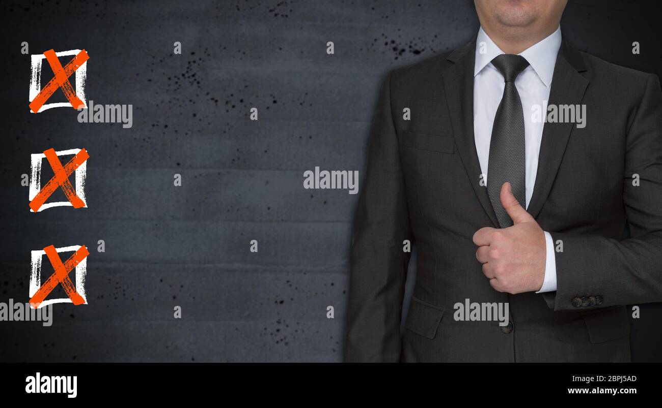 Checkbox concept and businessman with thumbs up Stock Photo - Alamy
