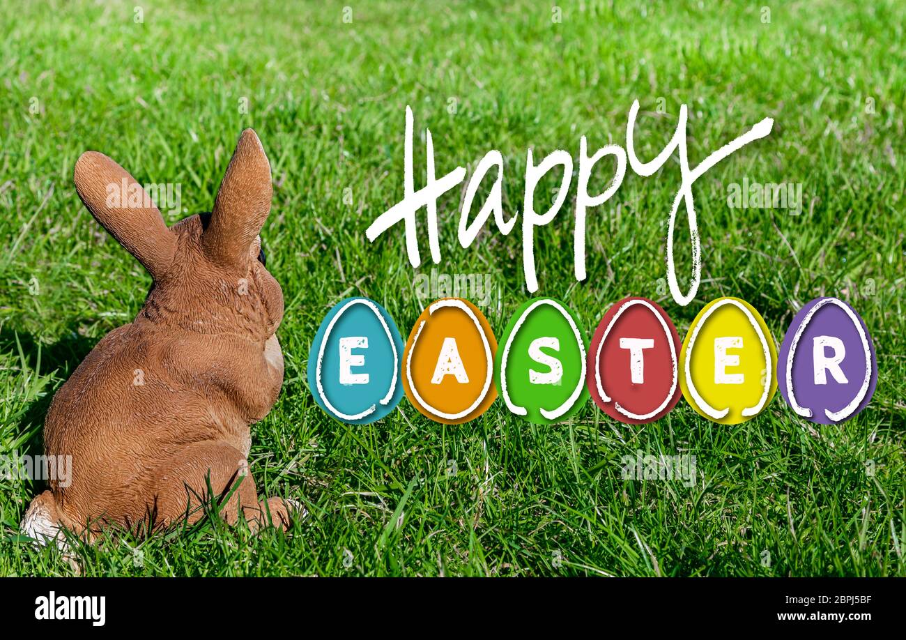 Happy Eastern with colorful eggs and Easter bunny on meadow Stock Photo ...