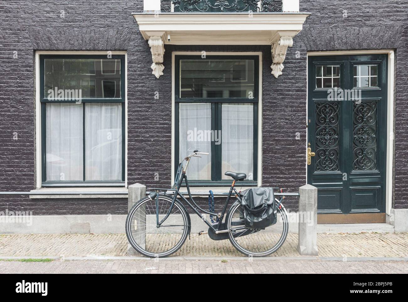 Typical Amsterdam old town street view in Netherlands with old doors ...