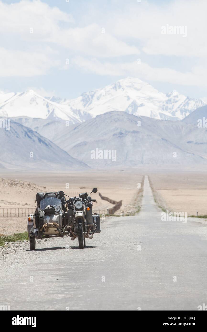 A sidecar motorcycle backed by a mountain range Stock Photo - Alamy