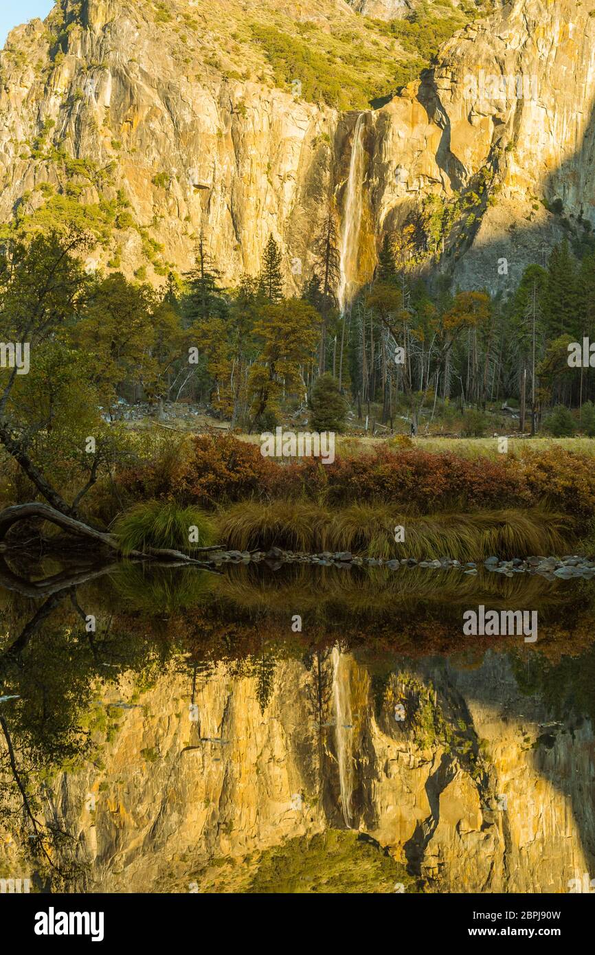 The Bridalveil Fall and its reflection in the Merced River at sunset in ...