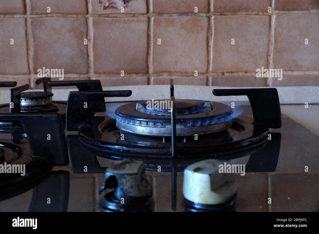 burning gas on a double-row gas ring on the stove Stock Photo - Alamy