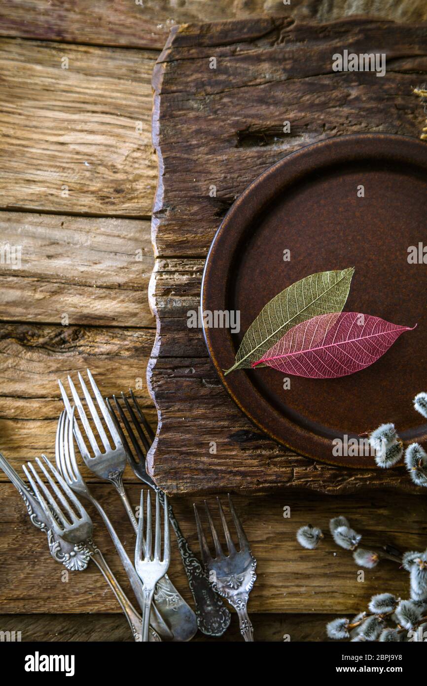 Spring table setting. Cutlery on wood. Rustic vintage forks Stock Photo ...