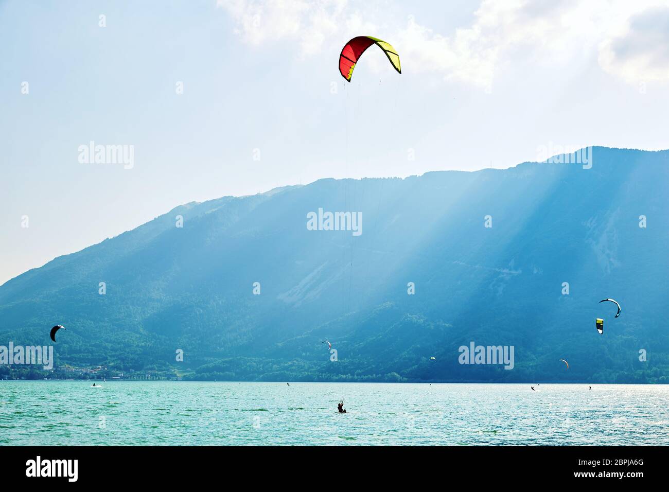 Colorful paragliding formation above Santa Croce Lake. Belluno, Italy ...