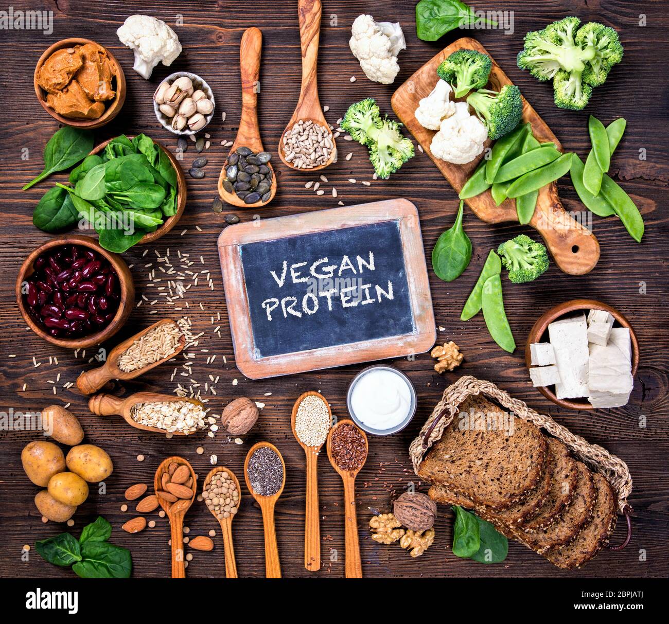 Vegan protein sources. Top view on a brown wooden background Stock ...