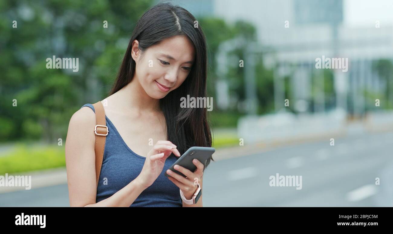 Young japanese woman smartphone downtown hi-res stock photography and ...