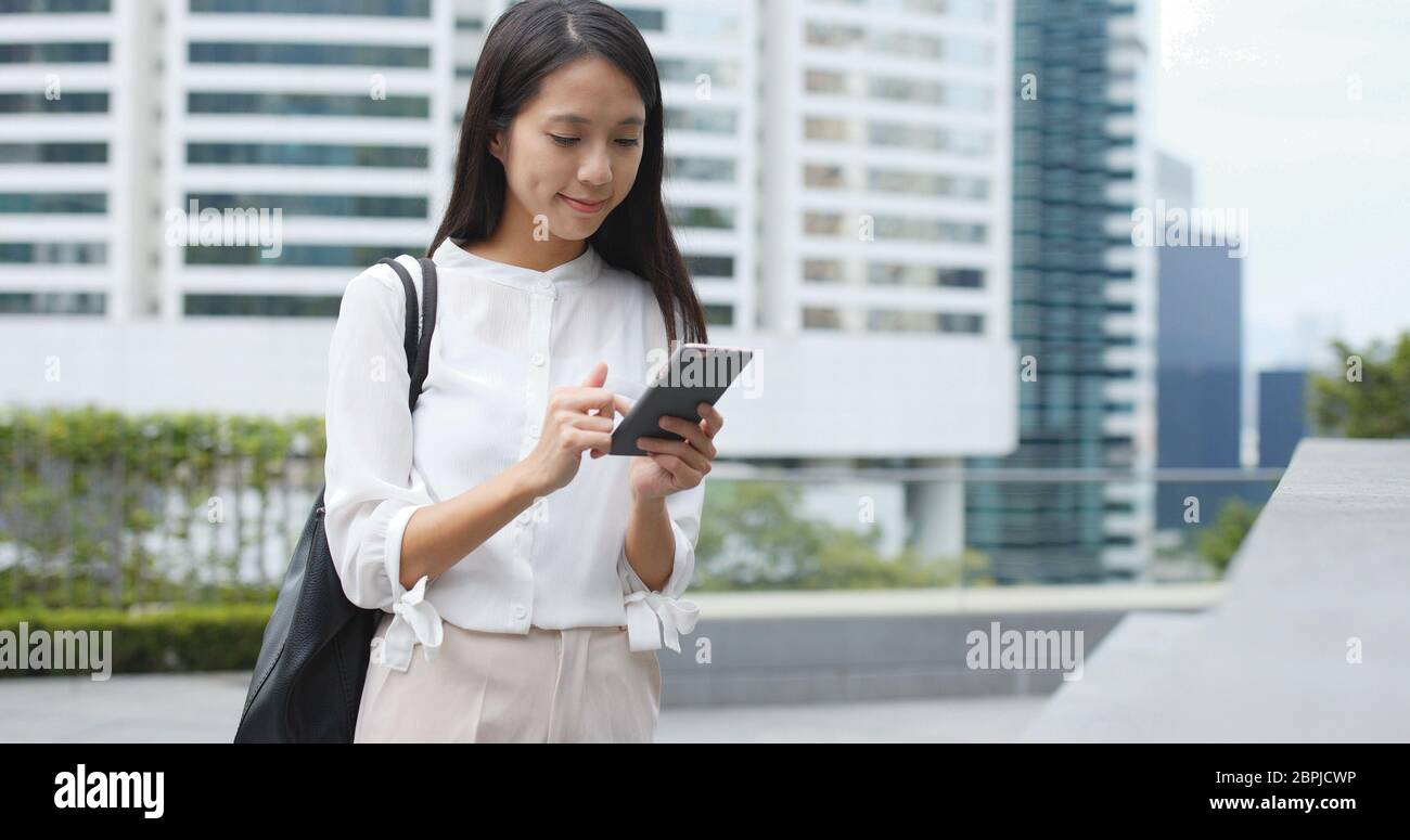 Woman send sms on mobile phone Stock Photo - Alamy