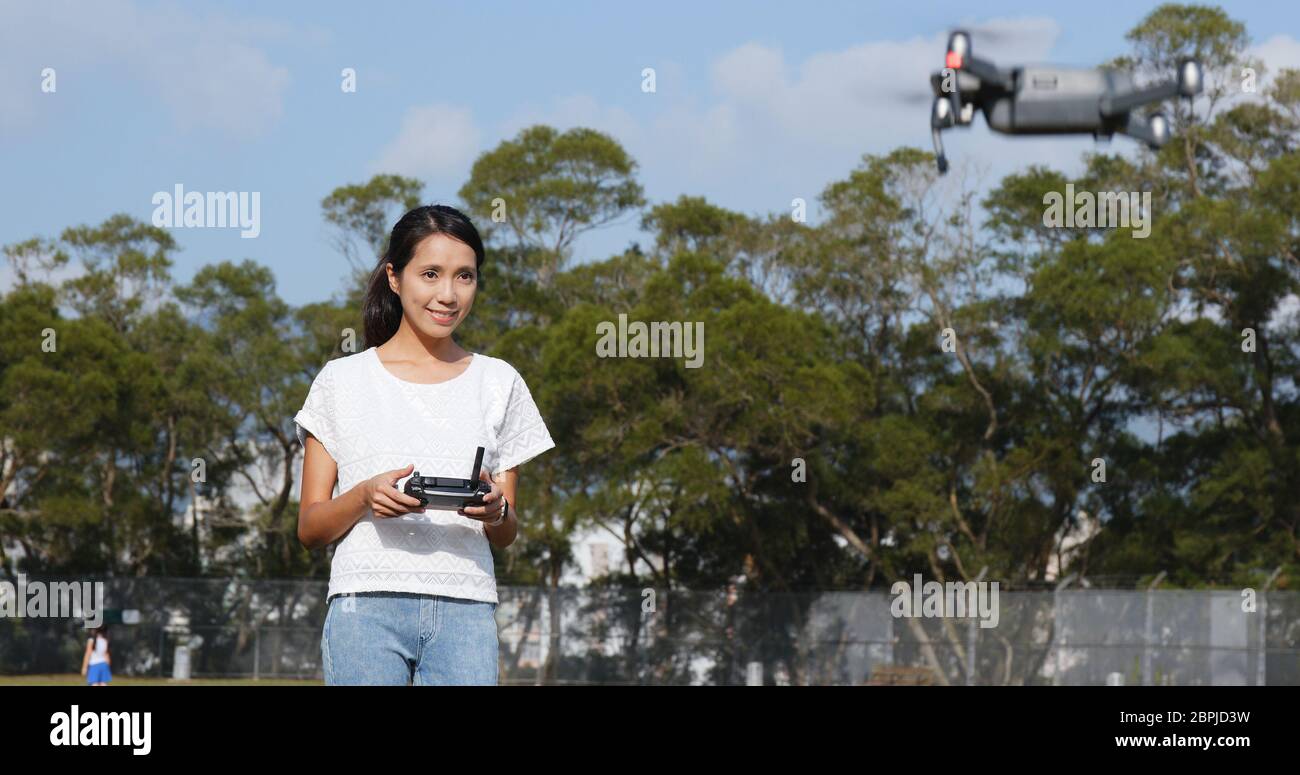 Woman piloting drone hi-res stock photography and images - Alamy