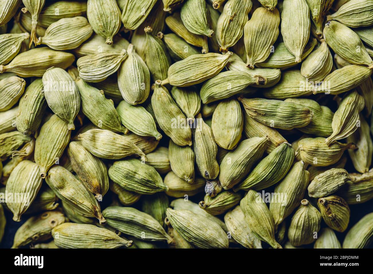 Background or texture with Pods of Green Cardamom Stock Photo - Alamy