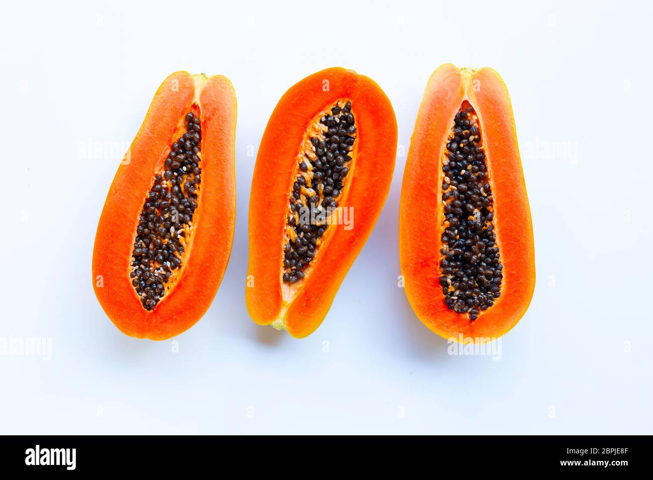 Half of ripe papaya fruit with seeds isolated on white background Stock ...