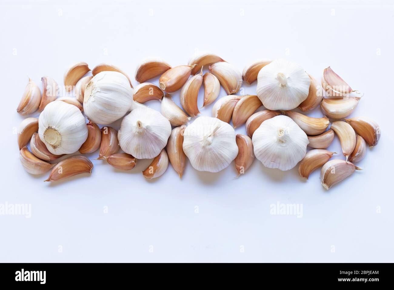 Garlic on white background. Top view Stock Photo - Alamy