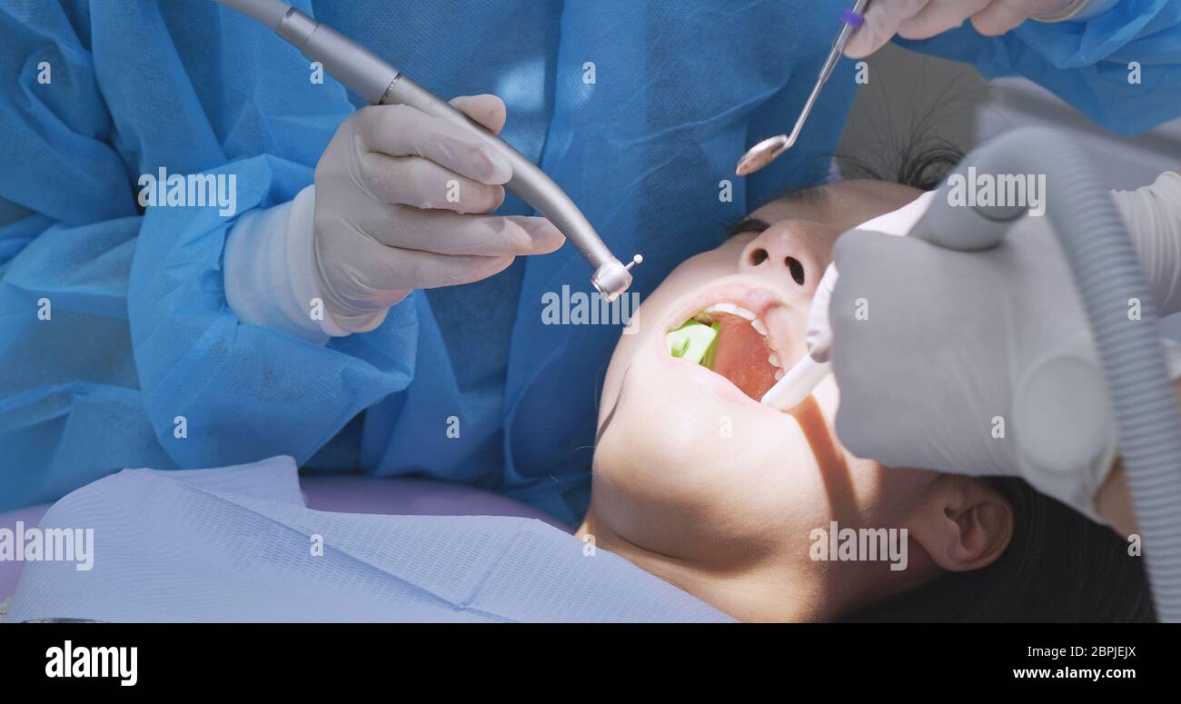 Woman examining teeth at dental office Stock Photo - Alamy