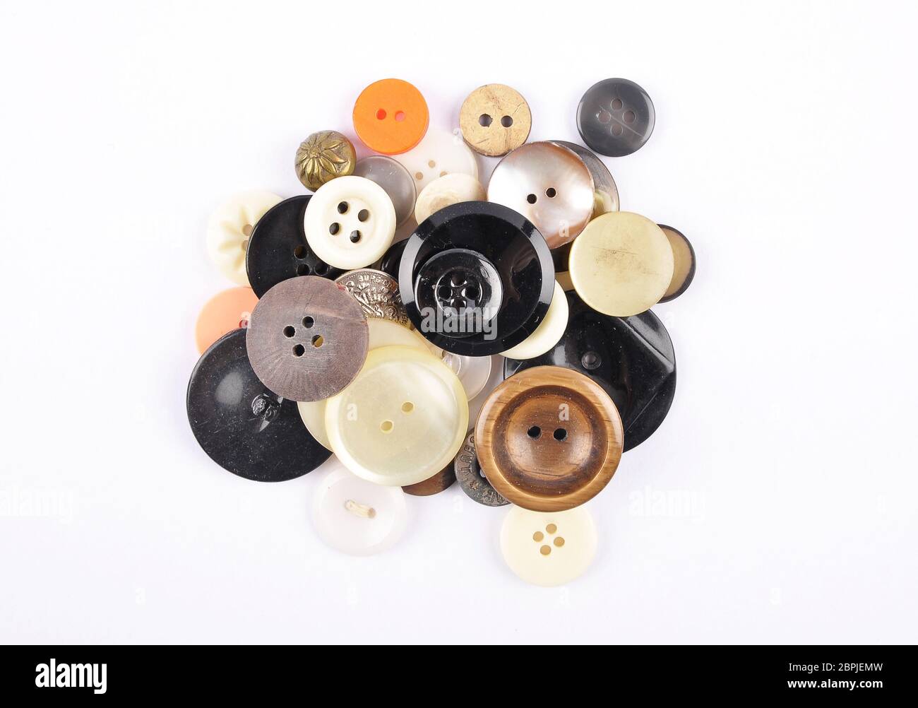 Old buttons on white background Stock Photo - Alamy