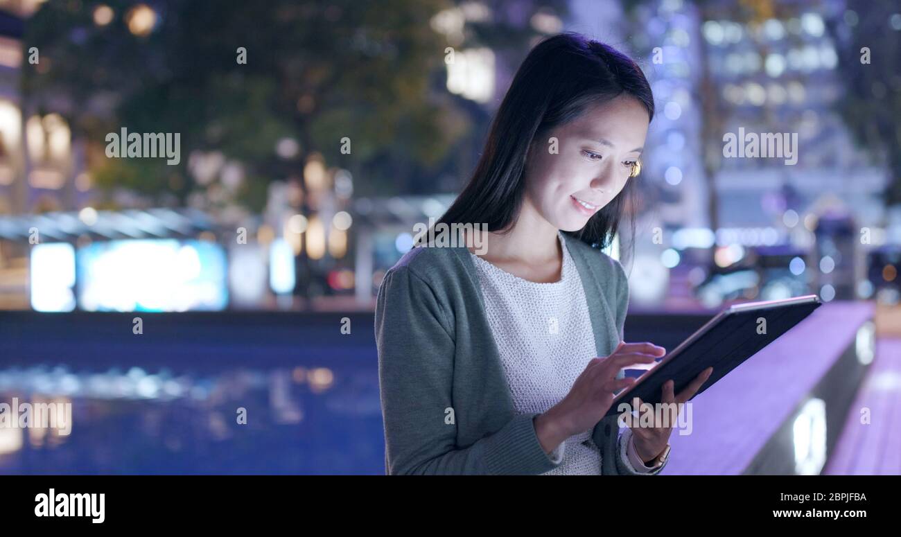 Woman use of tablet computer Stock Photo - Alamy