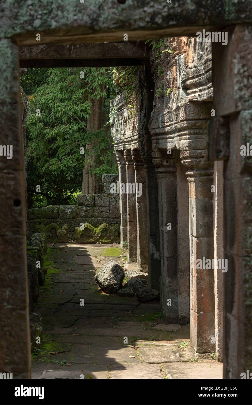 Wall of stone temple framed by arch Stock Photo - Alamy