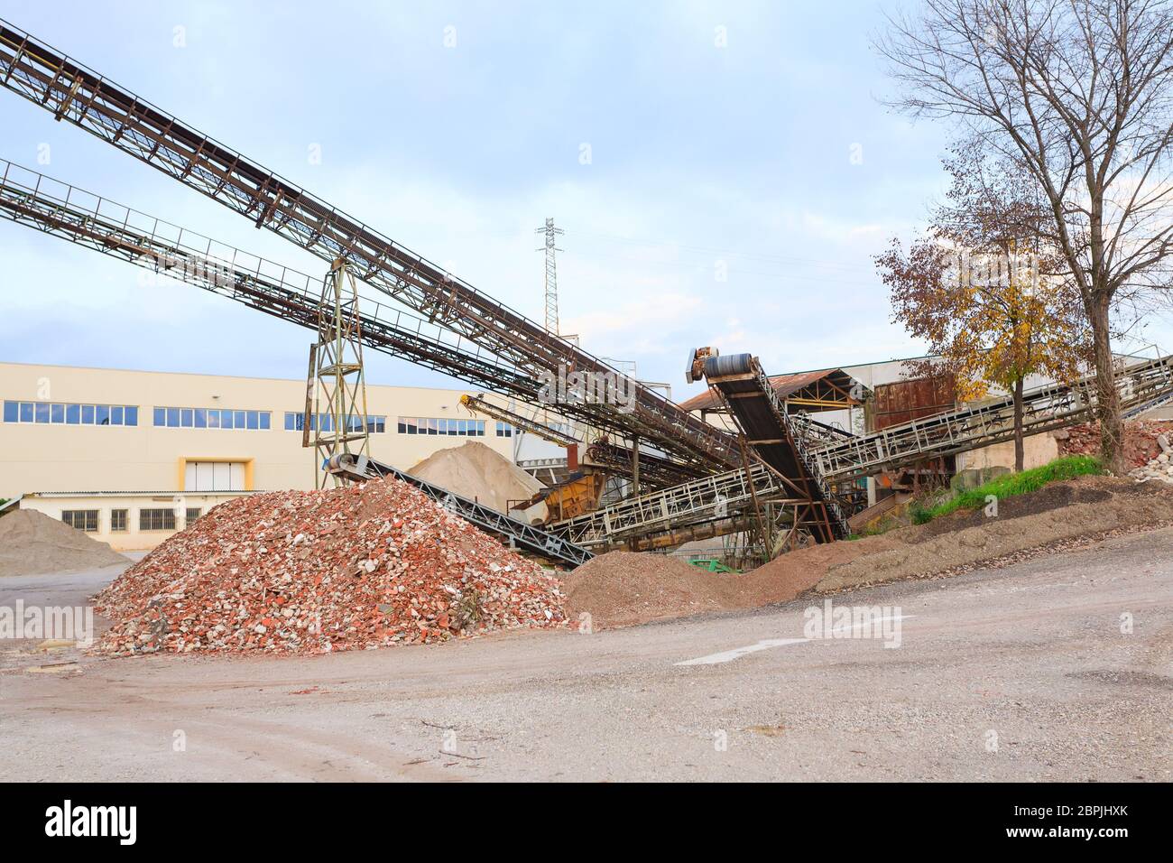 Stone quarry with silos and conveyor belts. Industrial equipment ...