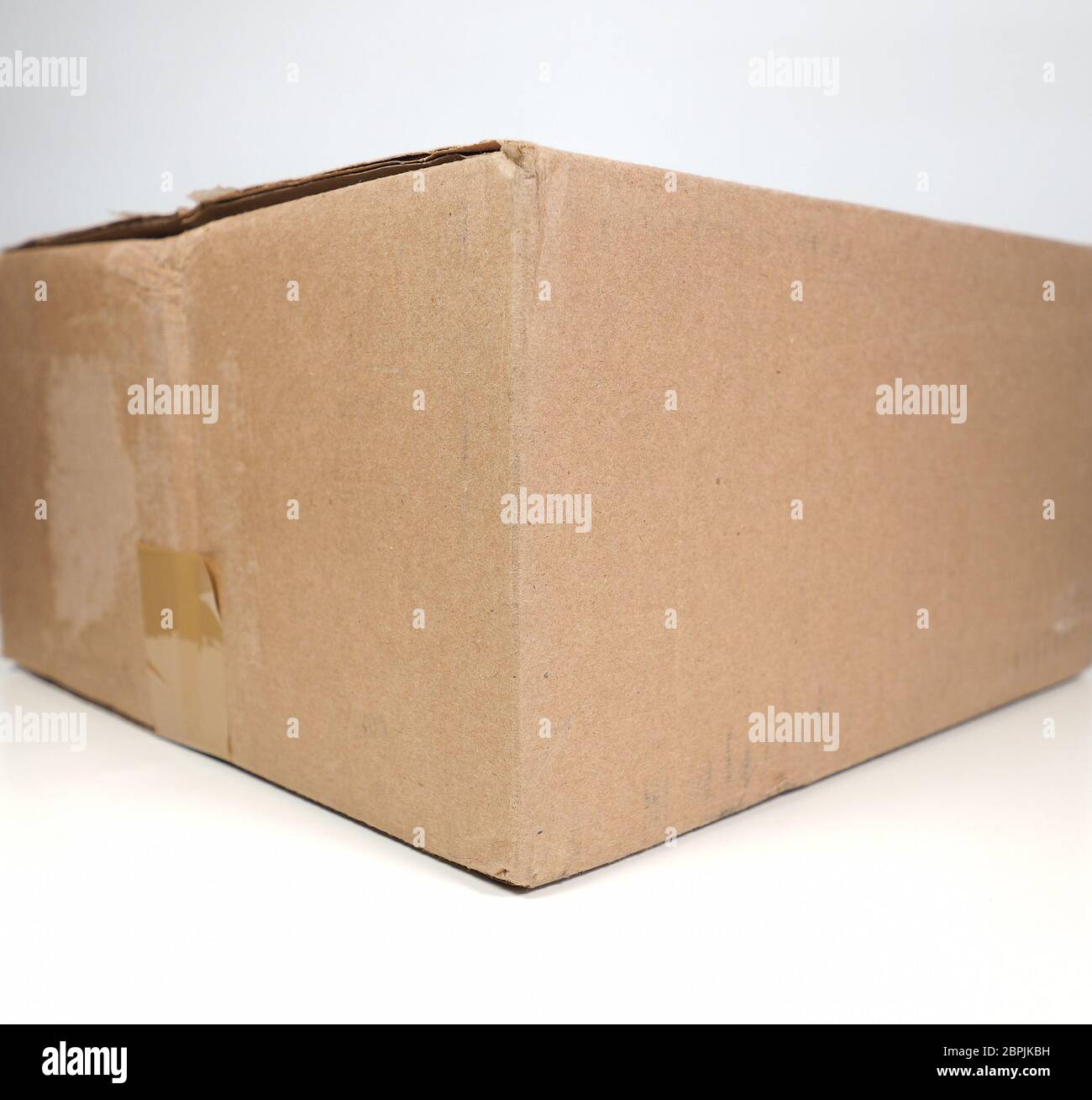 brown corrugated cardboard box for small packet parcel Stock Photo - Alamy