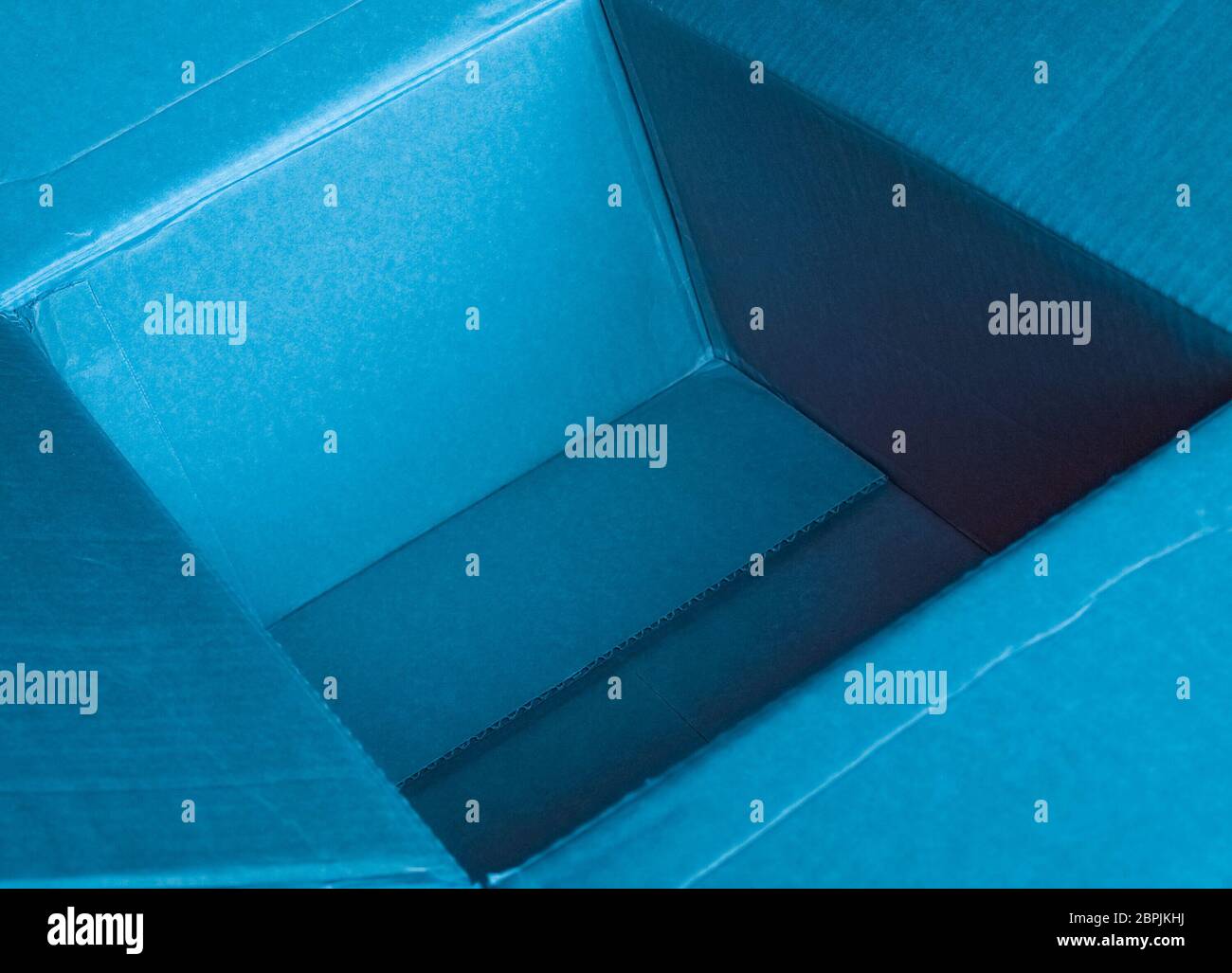 blue corrugated cardboard box for small packet parcel Stock Photo - Alamy