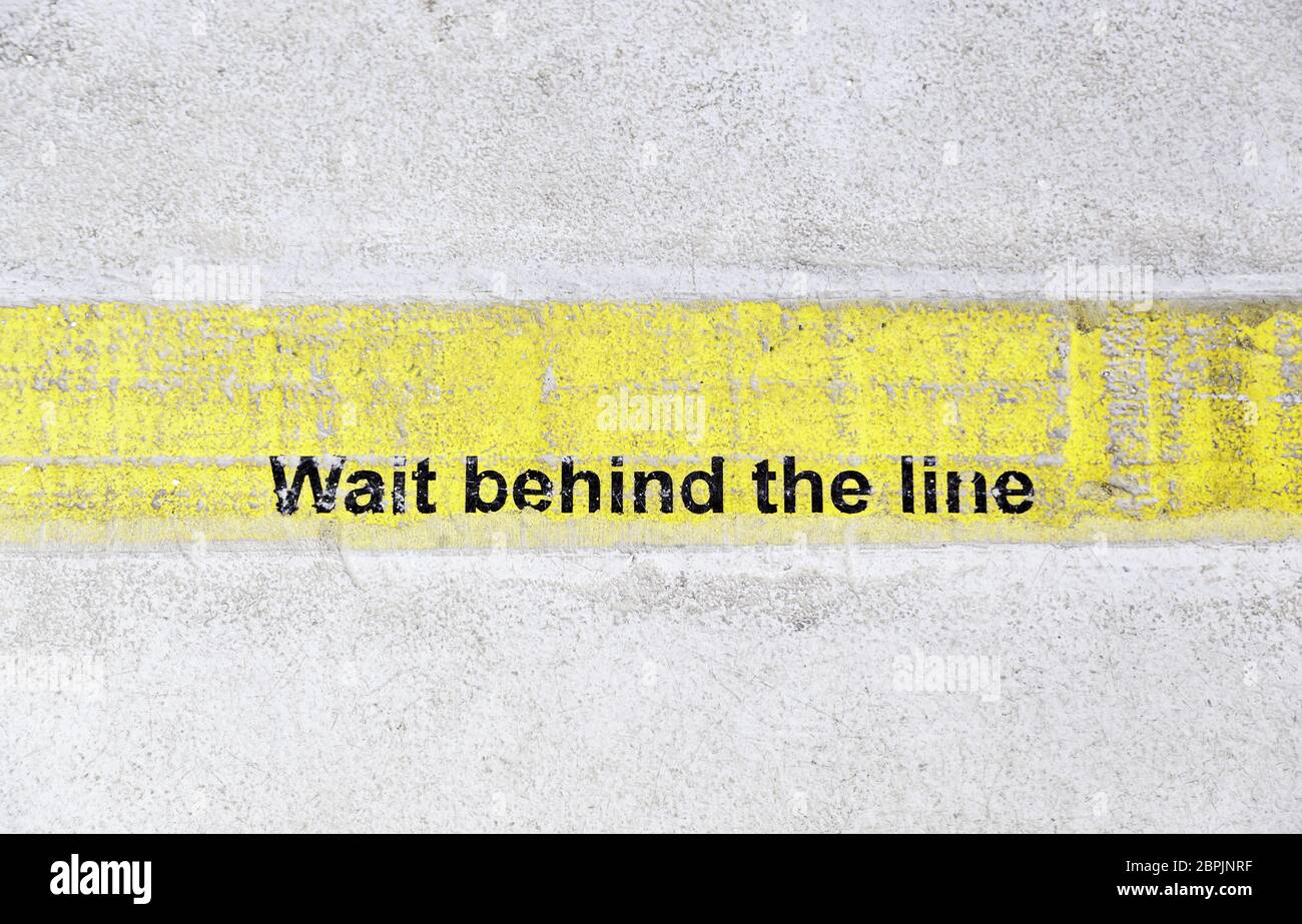 Wait behind the line, a signal detail and safety information Stock ...