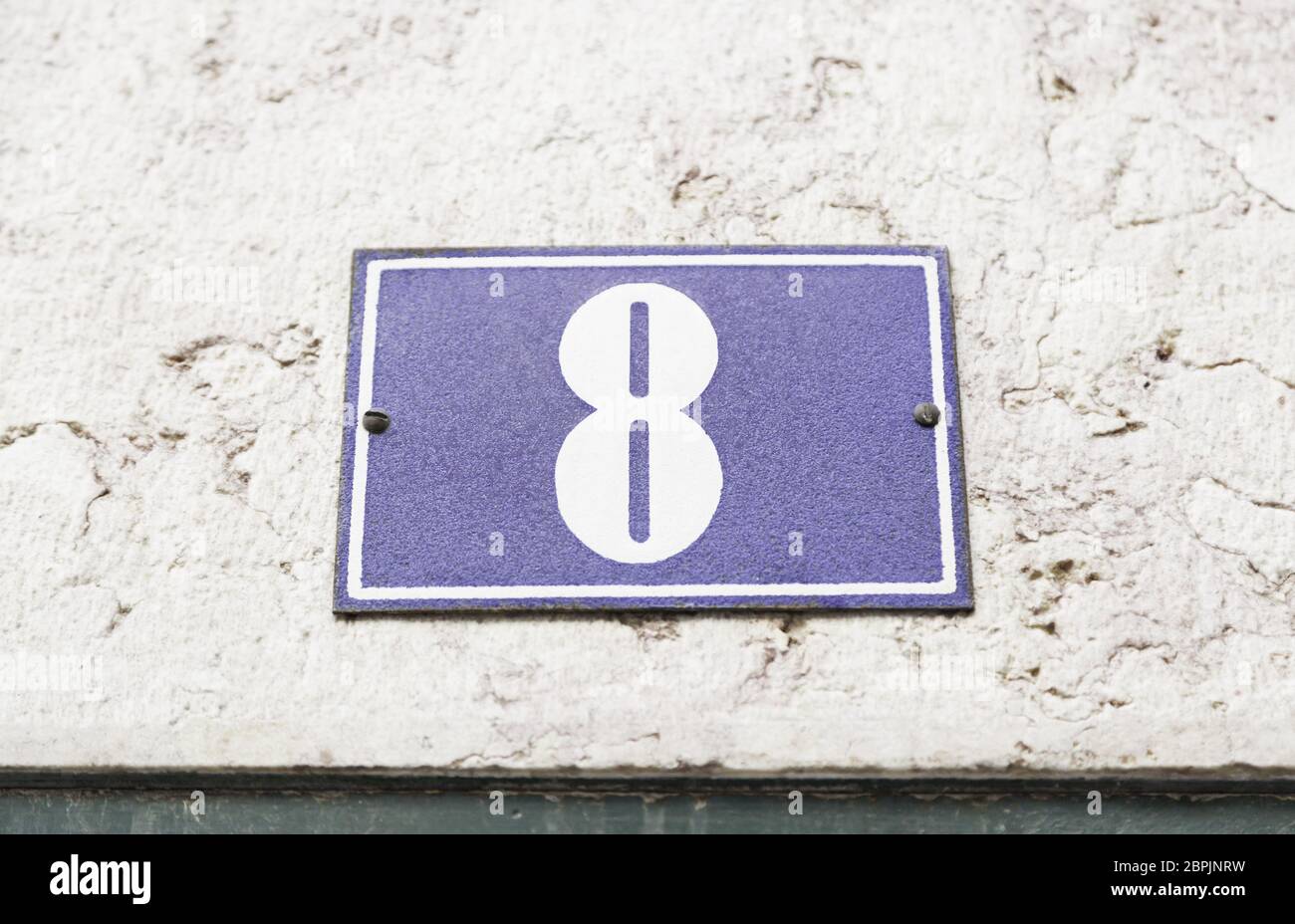 Number eight on a wall Stock Photo - Alamy