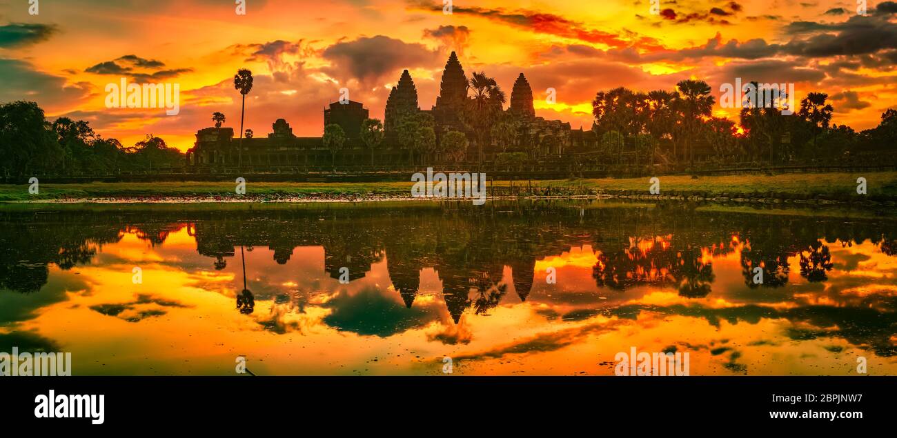 Angkor Wat temple reflecting in water of Lotus pond at sunrise. Siem ...