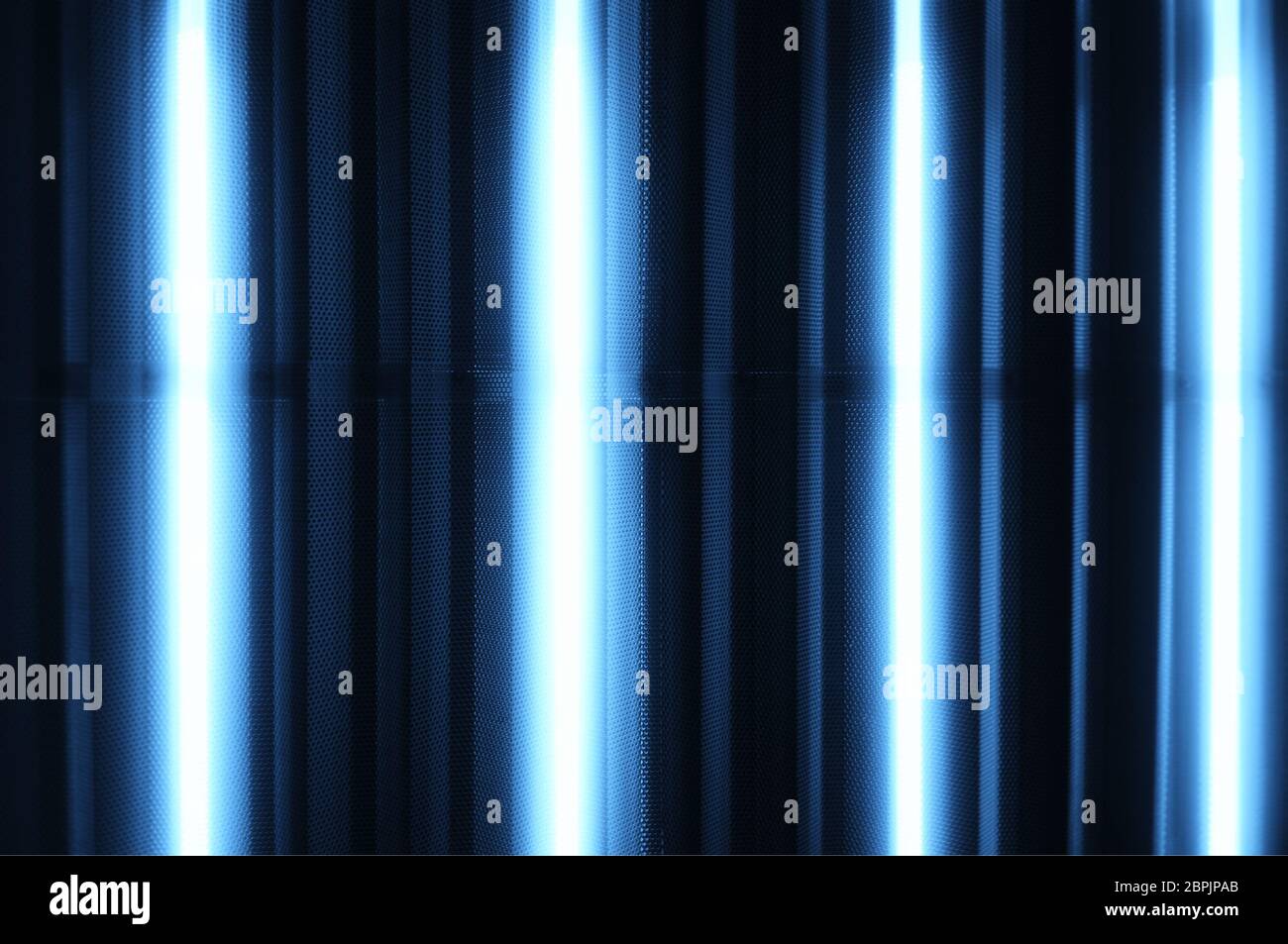 Vertical blue neon lamps illumination background Stock Photo - Alamy