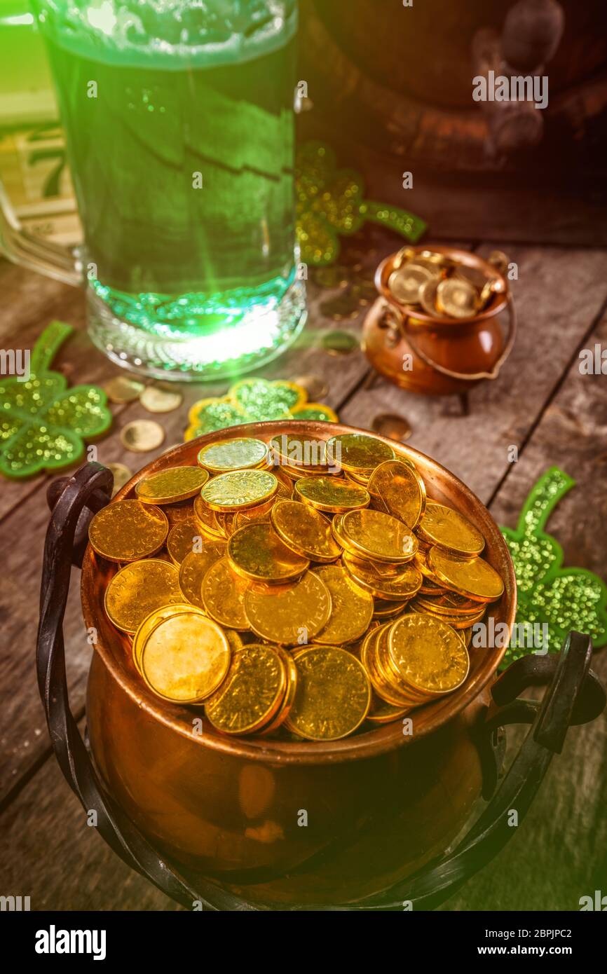 Happy St Patrick's Day concept with pot of gold coin Stock Photo - Alamy