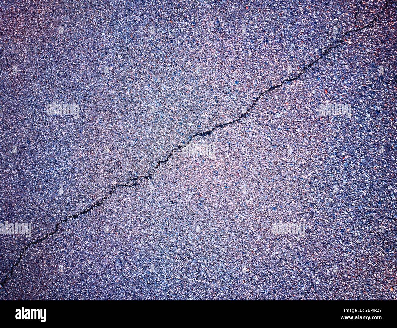 Diagonal crack in street asphalt background Stock Photo - Alamy