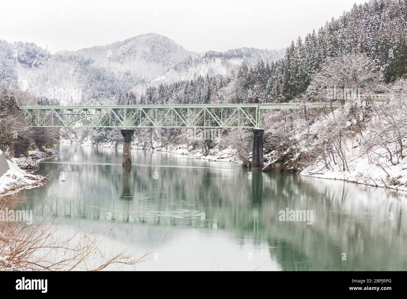 Train in Winter landscape snow on bridge Stock Photo - Alamy