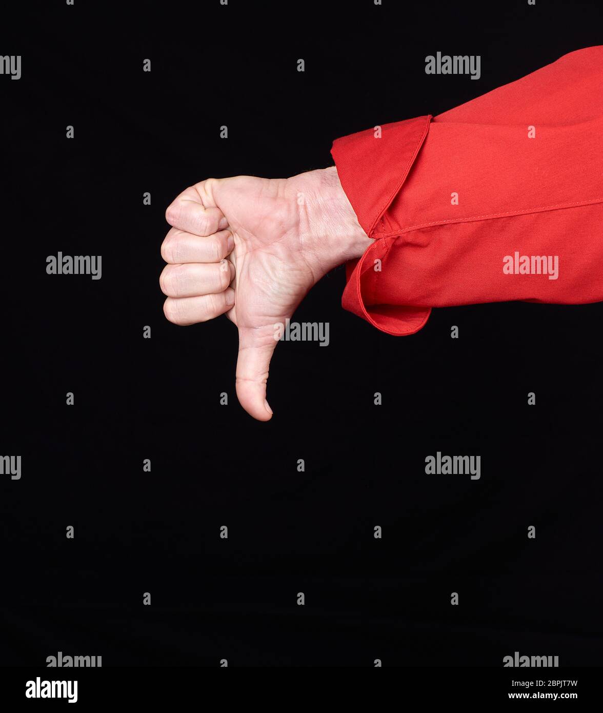cook in red uniform shows gesture dislike with hands, black background ...