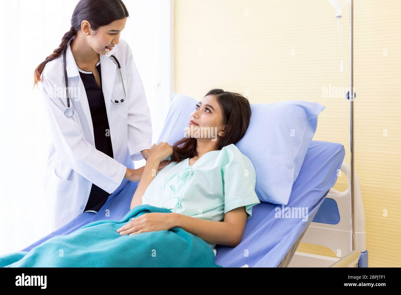 medical doctor touch on patient's sholder to cheer up patient Stock ...