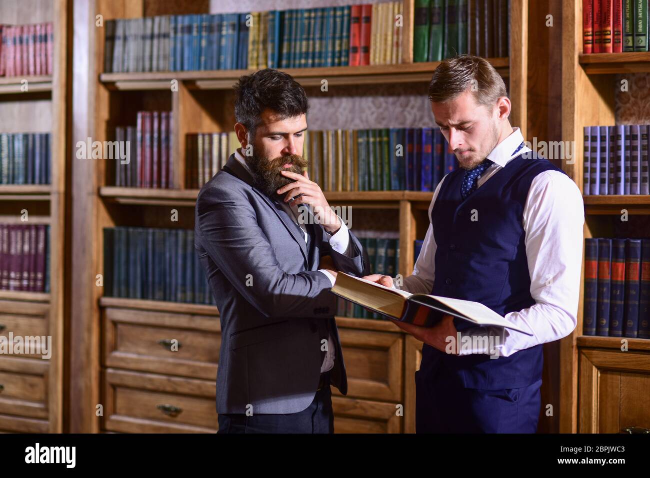 Intelligent elite and scientific people concept. Men in suit with ...