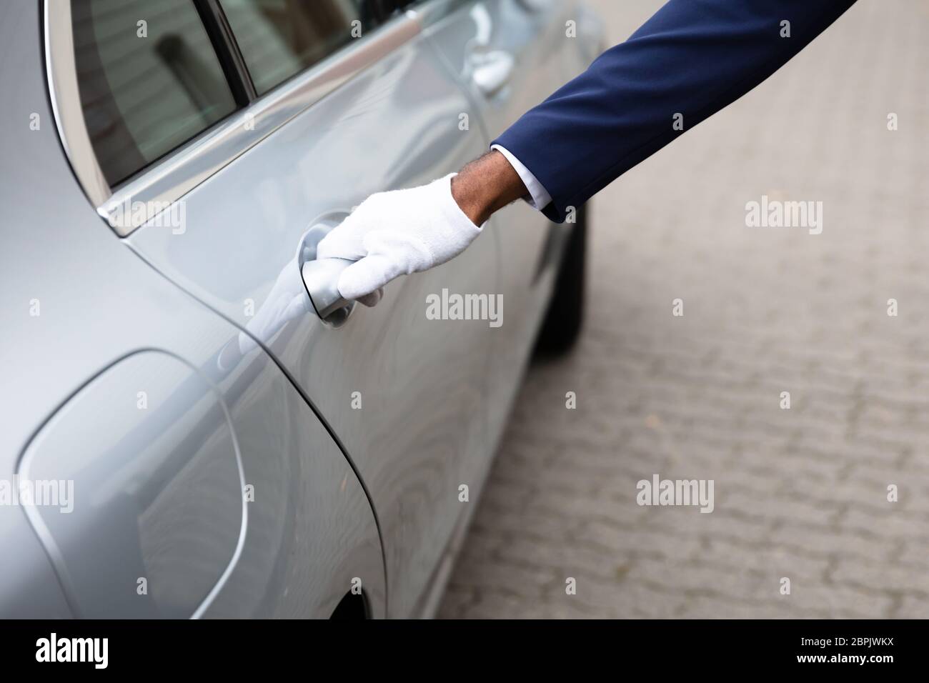 Opening car door gloves hi-res stock photography and images - Alamy