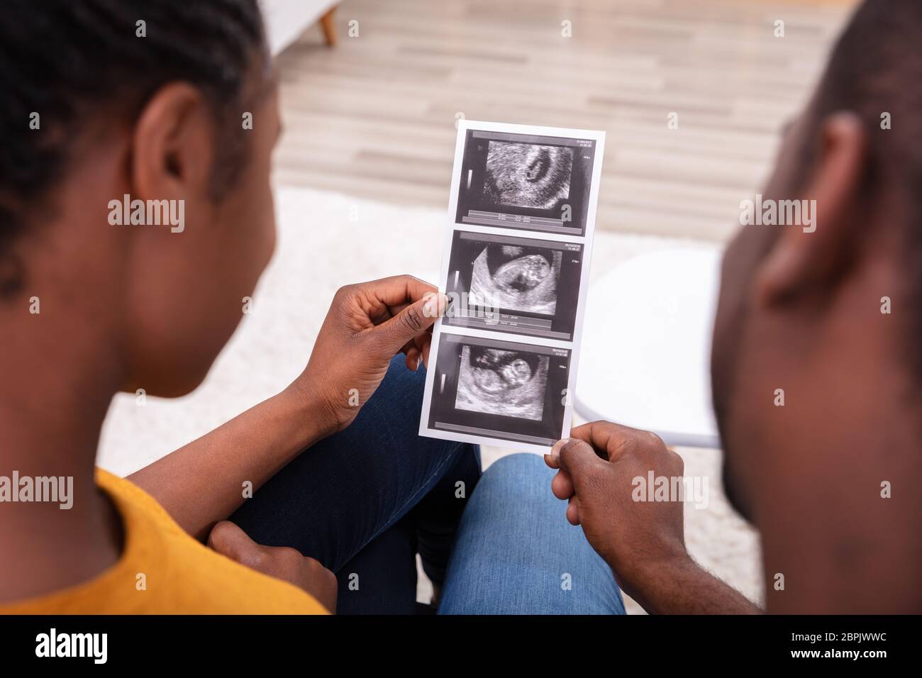 Close-up Of A Expectant Couple Looking At Ultrasound Scan Report Stock ...
