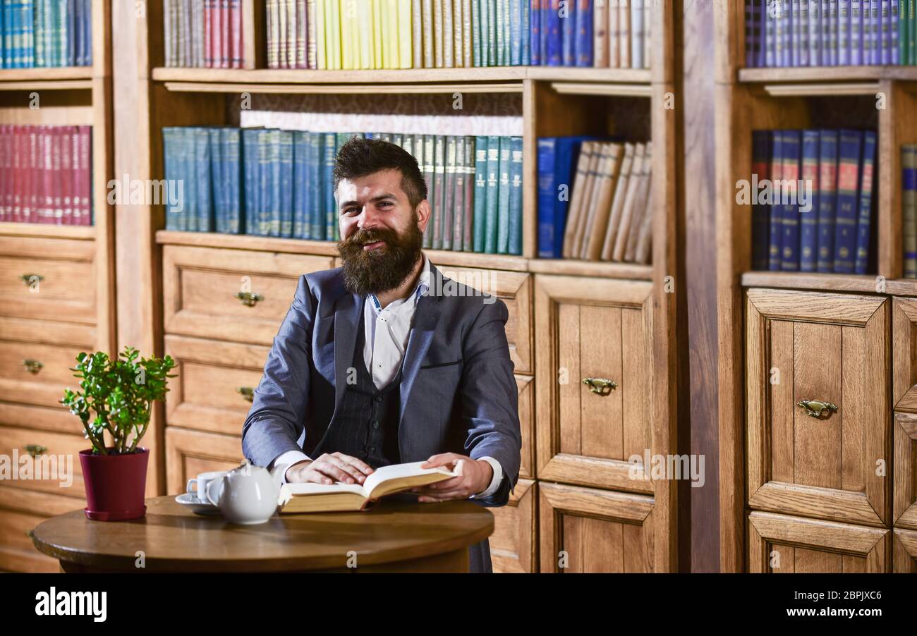 Aristocratic lifestyle concept. Aristocrat on smiling face reading book ...