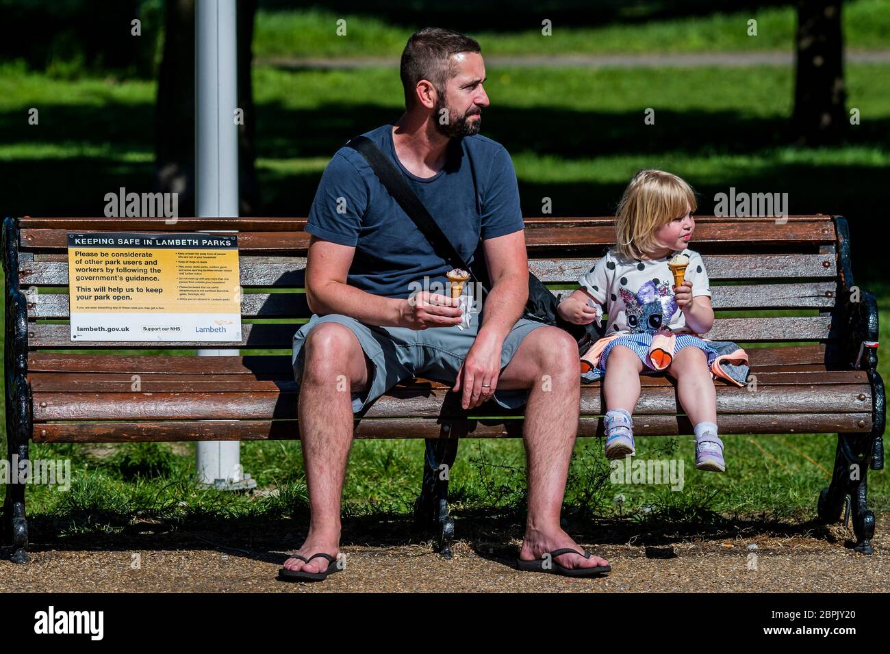 People enjoy the sun on clapham common hi-res stock photography and ...