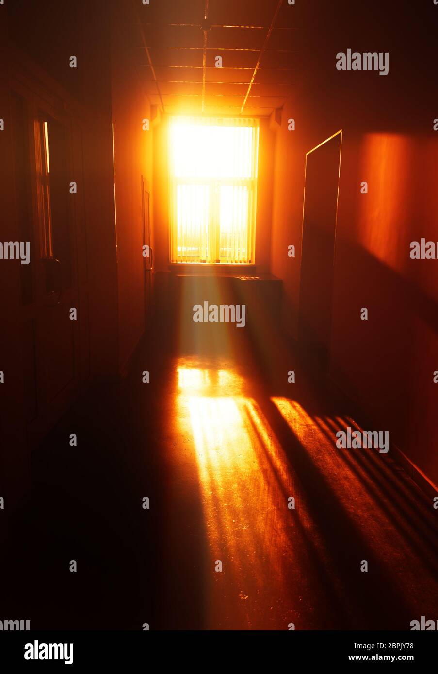 Dramatic light rays through office window background Stock Photo - Alamy