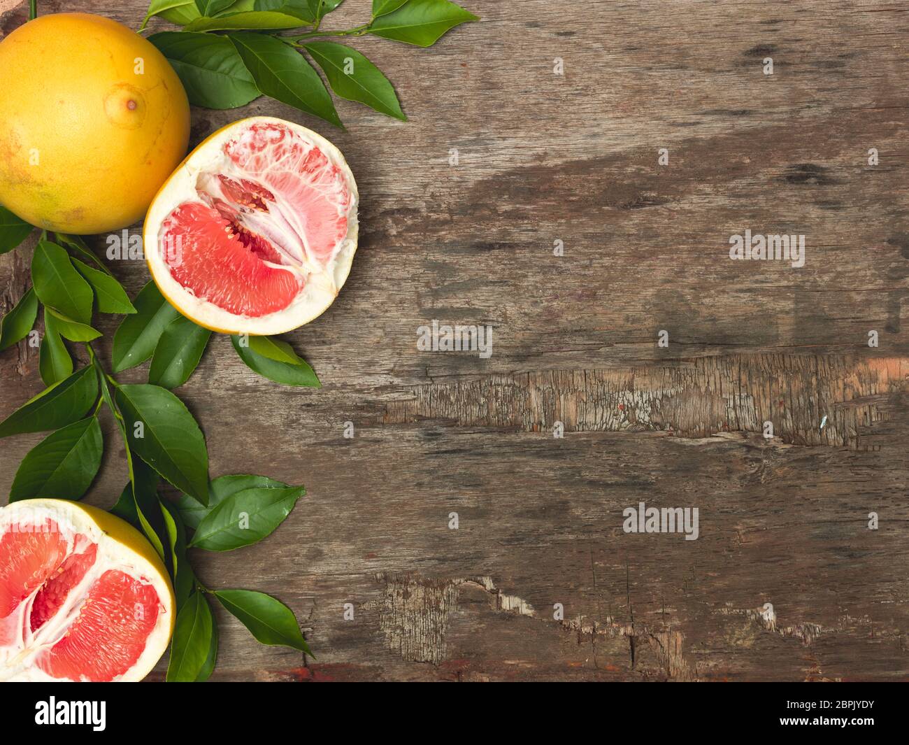juicy, healthy grapefruit, pomelo lies on an old, vintage wooden ...