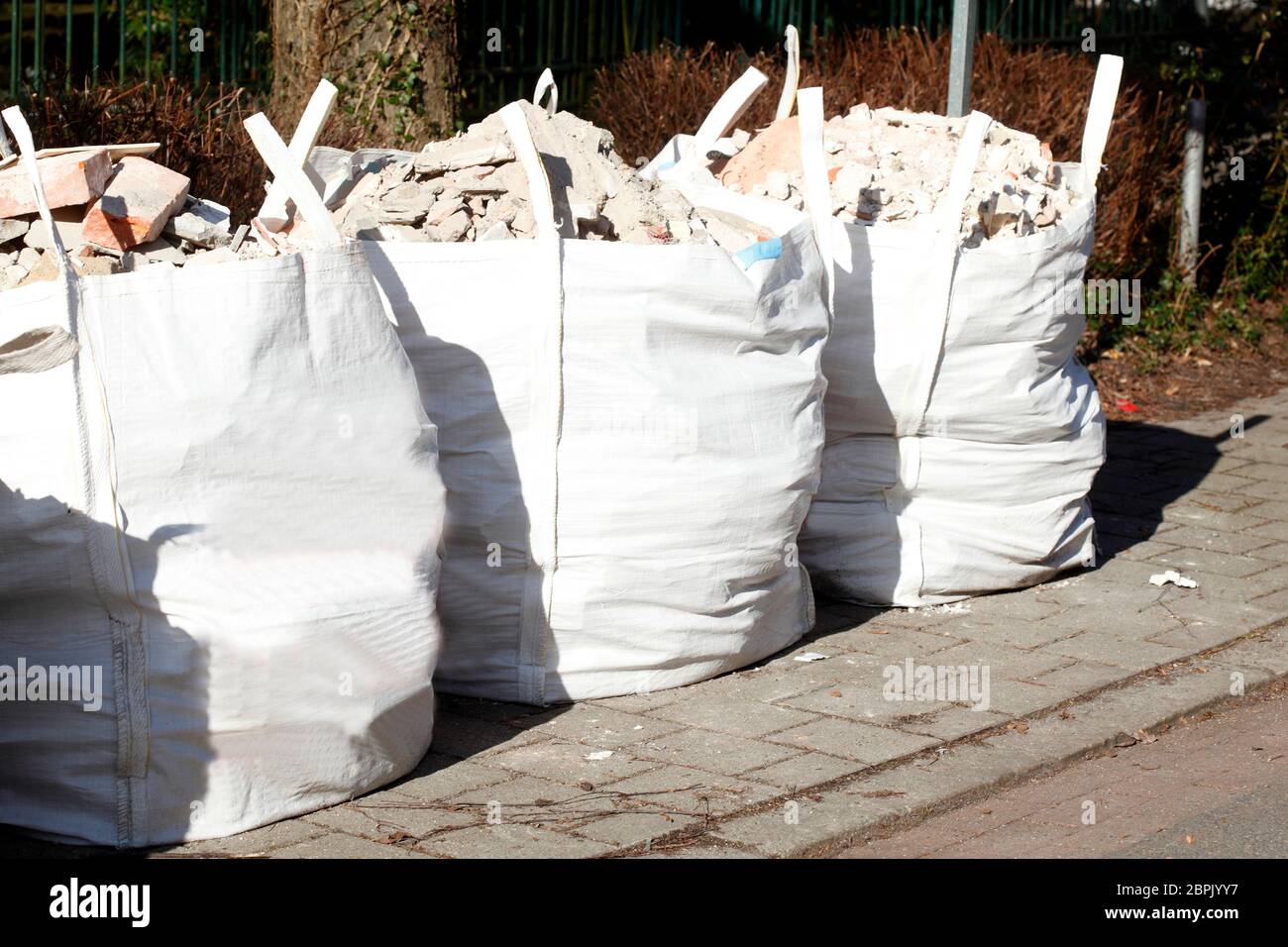 white garbage bags with rubble stones from a building site Stock Photo ...
