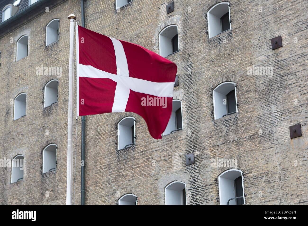 Danish flag waving in the wind outdoors Stock Photo - Alamy