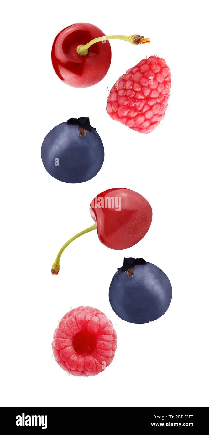 Flying fresh raspberry, cherry and blueberry isolated on white ...