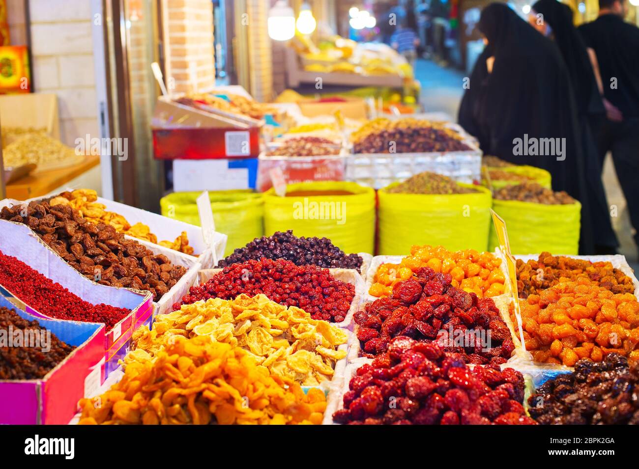 Women in hijab looking at dried fruits and nuts at stall of Grand ...