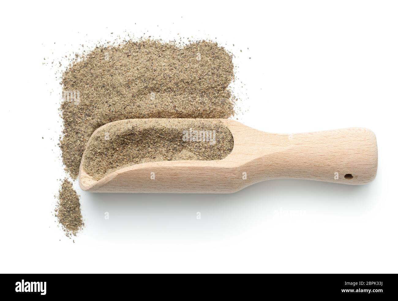 Black pepper powder on wooden scoop isolated on white background. Top ...