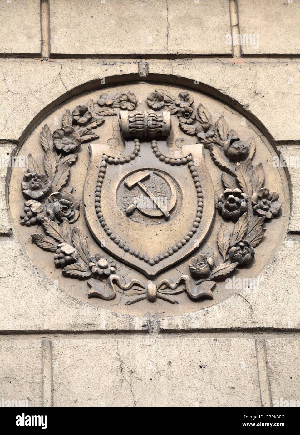 Soviet hammer and sickle emblem on the wall Stock Photo - Alamy