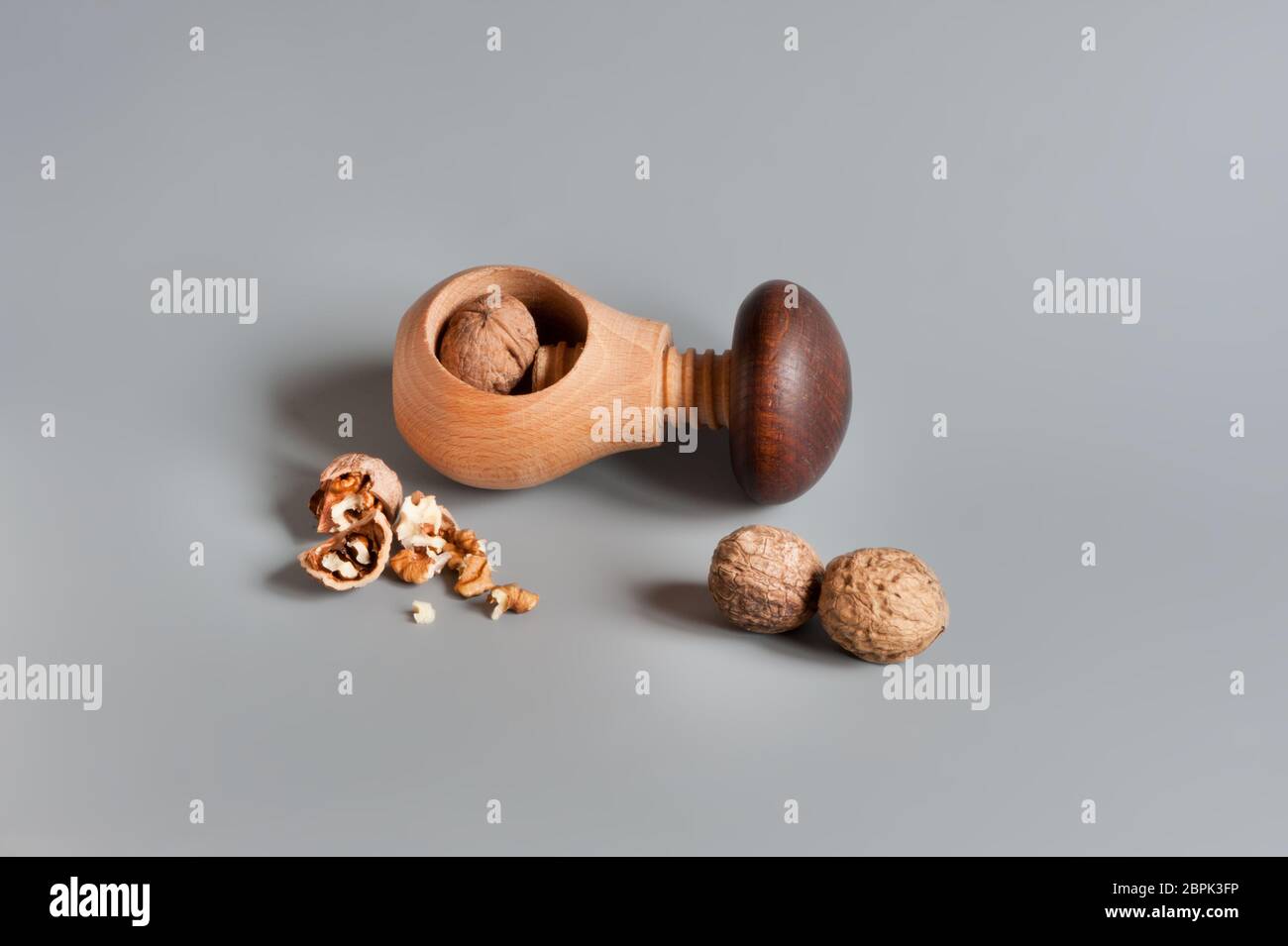Wooden nutcracker with walnuts Stock Photo - Alamy
