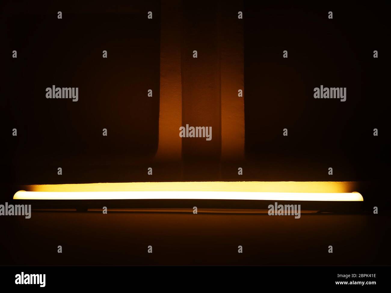 Dramatic orange neon lamp background Stock Photo - Alamy