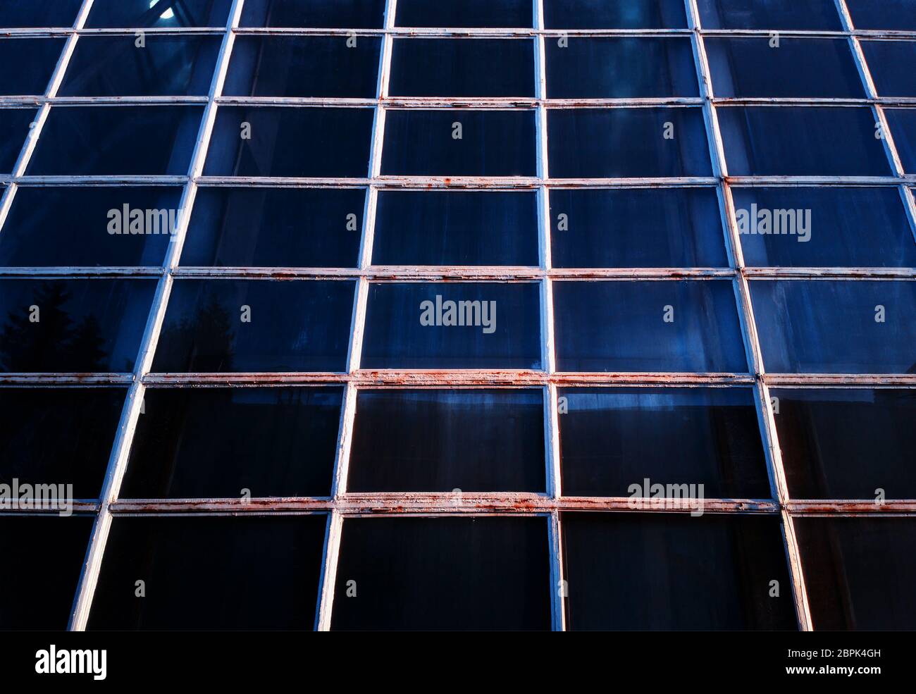 Dramatic industrial windows of old factory background Stock Photo - Alamy