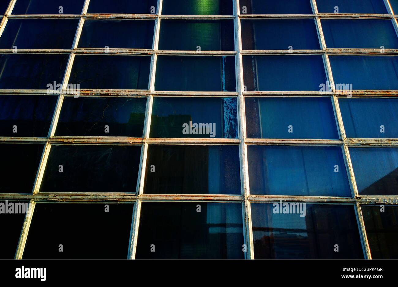 Dramatic industrial windows of old factory background Stock Photo - Alamy