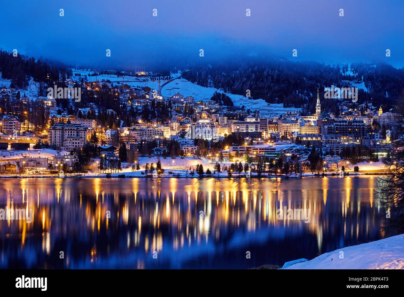 St. Moritz resort at night. Lights reflecting on lake. Switzerland ...