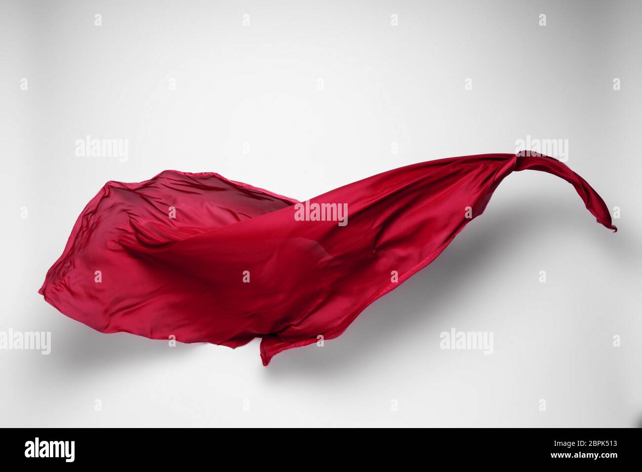 abstract piece of red fabric flying, high-speed studio shot Stock Photo ...